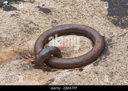 Mooring ring on stone embankment of river Stock Photo - Alamy