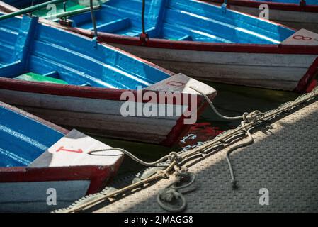 An old wooden pier with small boats in Comporta, Portugal Stock Photo ...