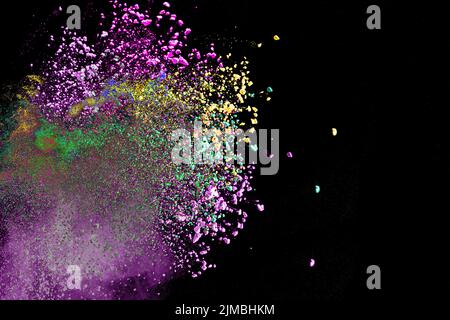 splash of multi-colored ink on a black background. paint explosion ...