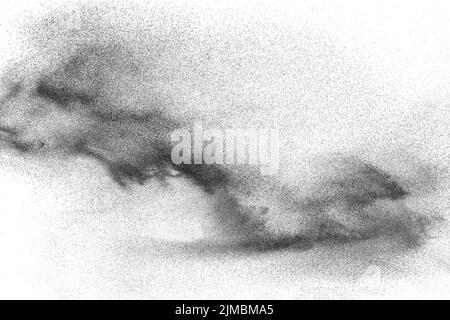 Black particles splattered on white background. Black powder dust ...