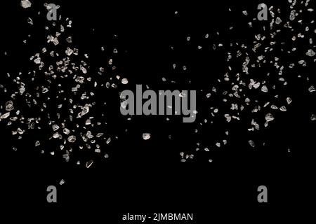 Split debris of stone exploding against black background Stock Photo ...