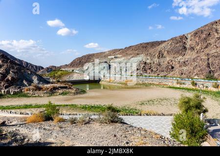 Wadi Shawka Dam dry riverbed with winding staircase leading to the top ...