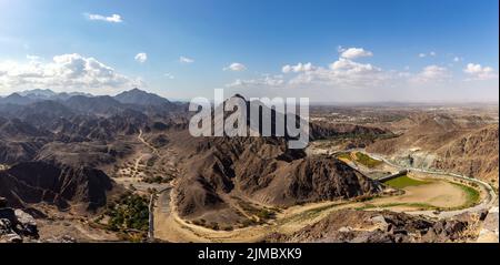 Wadi Shawka Dam dry riverbed with winding staircase leading to the top ...