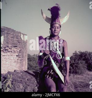 Circa 1956, India: Naga tribesman warriors with bone decorations on his ...