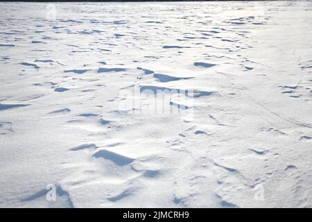 Snow drifts caused by wind from powder snow look like dunes and form ...