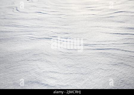 Snow drifts caused by wind from powder snow look like dunes and form ...