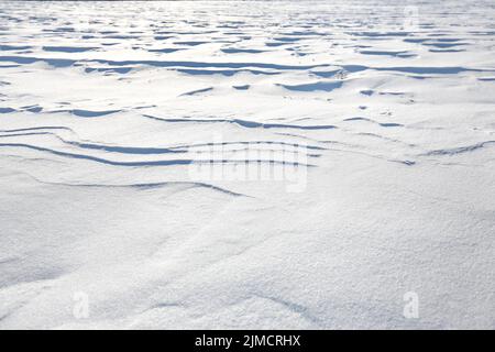 Snow drifts caused by wind from powder snow look like dunes and form ...