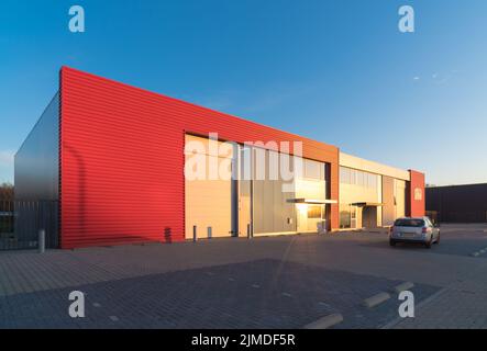 exterior of a modern warehouse with a small office unit Stock Photo - Alamy