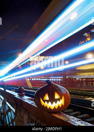 A creepy pumpkin with a carved grimace in the smoke. Jack o lantern in ...