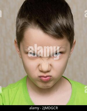 portrait of an offended boy Stock Photo - Alamy