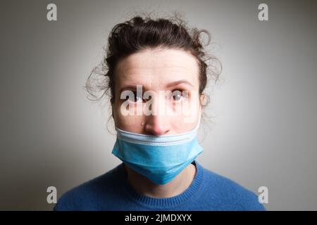 Masked girl crying Stock Photo - Alamy