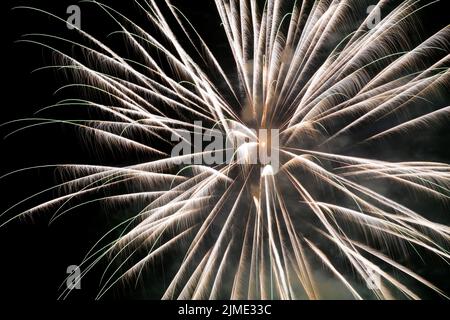 Bright, beautiful red fireworks in the night sky Stock Photo - Alamy