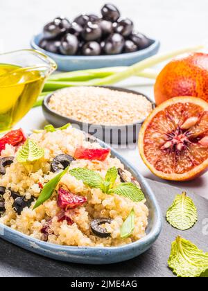 Vegan salad with quinoa, red orange and black olives Stock Photo - Alamy