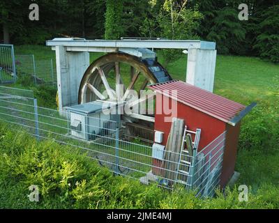 Water wheel for generating electricity Stock Photo - Alamy