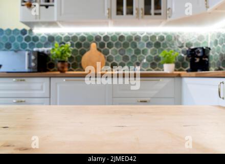blurred kitchen interior and desk space home background Stock Photo - Alamy