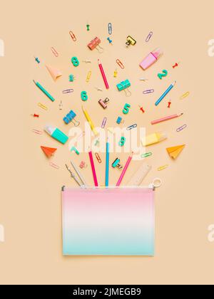 Neutral pastel beige background and school supplies, stationery ...