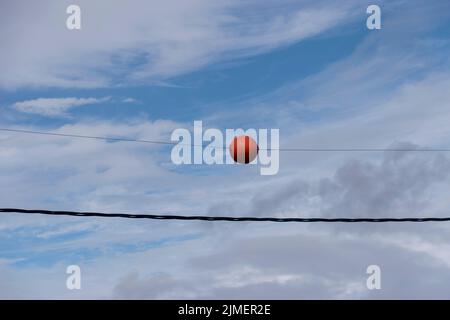 Red power line marker ball prevents accidental bird and aircraft ...