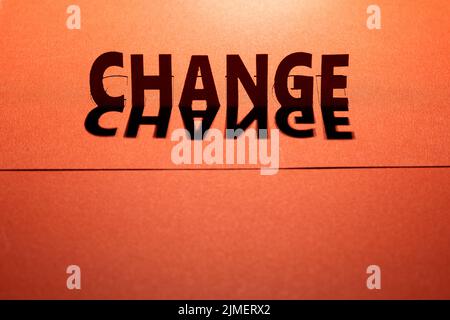 Change word cutting and standing from paper, lit from behind and ...