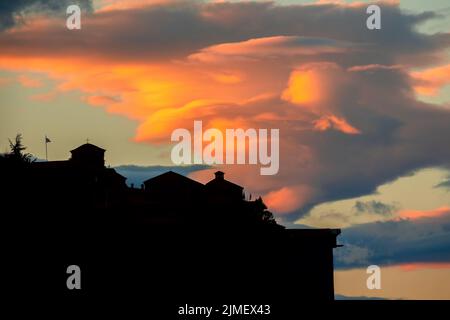 Silhouette of a Rock Monastery and Amazing Cloud Stock Photo - Alamy