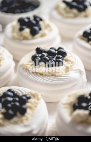 Homemade delicious mini Pavlova meringue made of fresh berries and ...