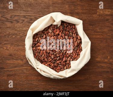 Sack of organic unpeeled cocoa beans Stock Photo - Alamy