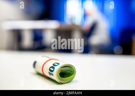 Euro cash. 100 hundred banknotes on white table. 1500 euros. business ...