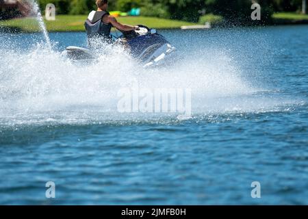 water jet rider, jet skiing, sea spray watersports Stock Photo - Alamy