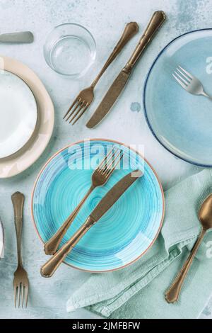 Crockery, tableware, utensils and other different stuff on wooden table ...