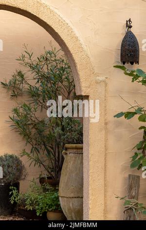 Arabic style lamp on the wall of a typical middle eastern architecture ...