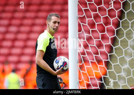 Referee David Coote checks the goal line technology before the game ...