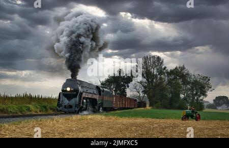 An Antique Restored Steam Freight Train Approaching Head on Blowing ...