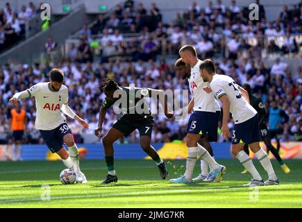 Tottenham Hotspur's Rodrigo Bentancur (left) attempts a shot on goal ...