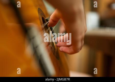 Kids hands on guitar strings. Playing guitar Stock Photo - Alamy