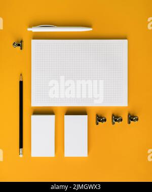 Blank business cards, clips and pen on color background Stock Photo - Alamy