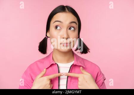 Cute korean girl with silly hairbuns, looking happy and grateful, thank ...