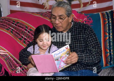Native American family of Shoshone Bannock grandfather reading a story ...