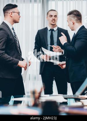 business partners discussing contract terms in office .business concept ...