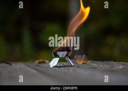 Flames from alcohol. Burning dry alcohol. Object for heating substances ...
