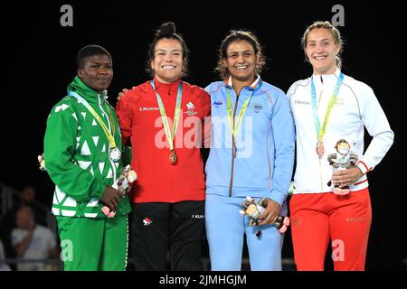 Canada's Justina di Stasio, left, competes against Hannah Amuchechi ...