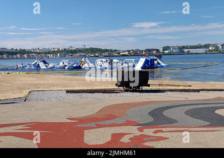 Coal truck artwork installaCardiff Aqua Park inflatable obstacle course ...