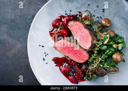 Modern style traditional fried dry aged angus beef filet medaillons ...