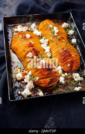 Traditional fried hasselback butternut squash pumpkin roast with herbs ...
