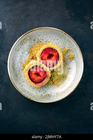 Traditional Austrian plum dumpling with a backed prune in a dough coat ...