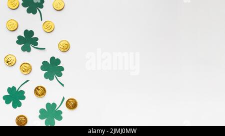 Flat lay clovers gold coins Stock Photo - Alamy