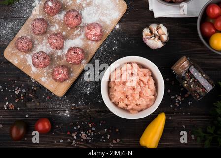 Flat lay meatballs wooden board minced meat Stock Photo - Alamy