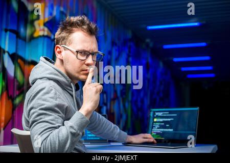 portrait of hacker with mask and binary code background Stock Photo - Alamy