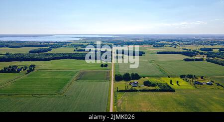 A rural scene of wisconsin farms during summer with lake winneconnie in ...