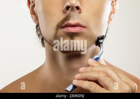 Male face with a partially shaved beard Stock Photo - Alamy