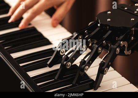 Human with neural hand prosthesis playing piano Stock Photo - Alamy