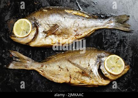 Baked dorado fish on oven tray Stock Photo - Alamy